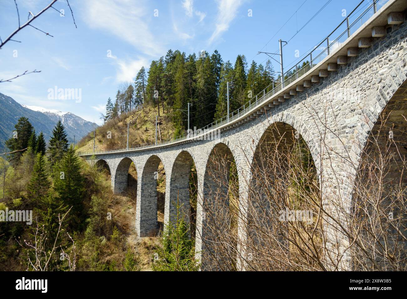 Low angle view of a single-track limestone railway viaduct in the Swiss ...