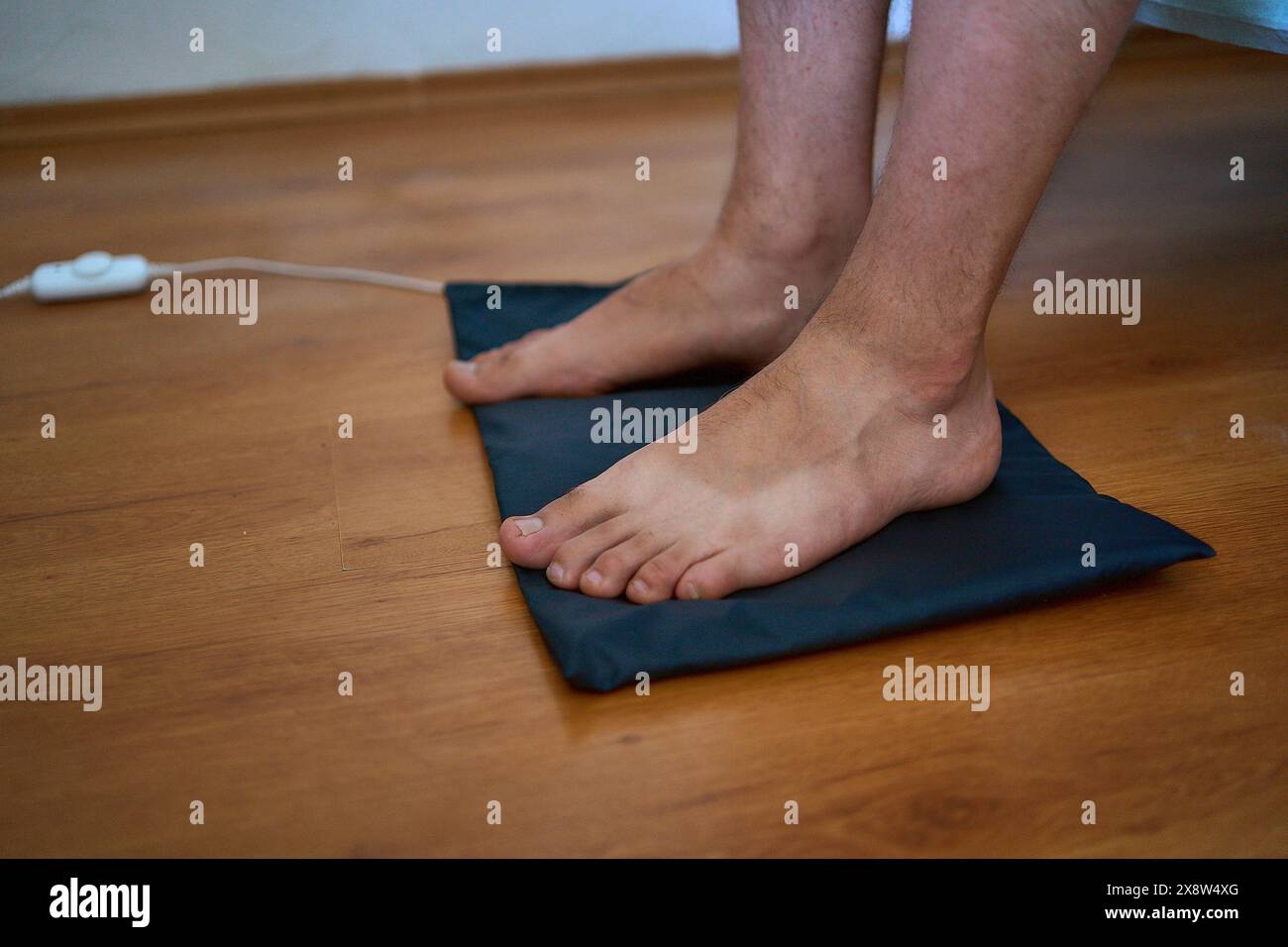 the man put his feet on the grounding wedge, self-soothing, relaxation ...