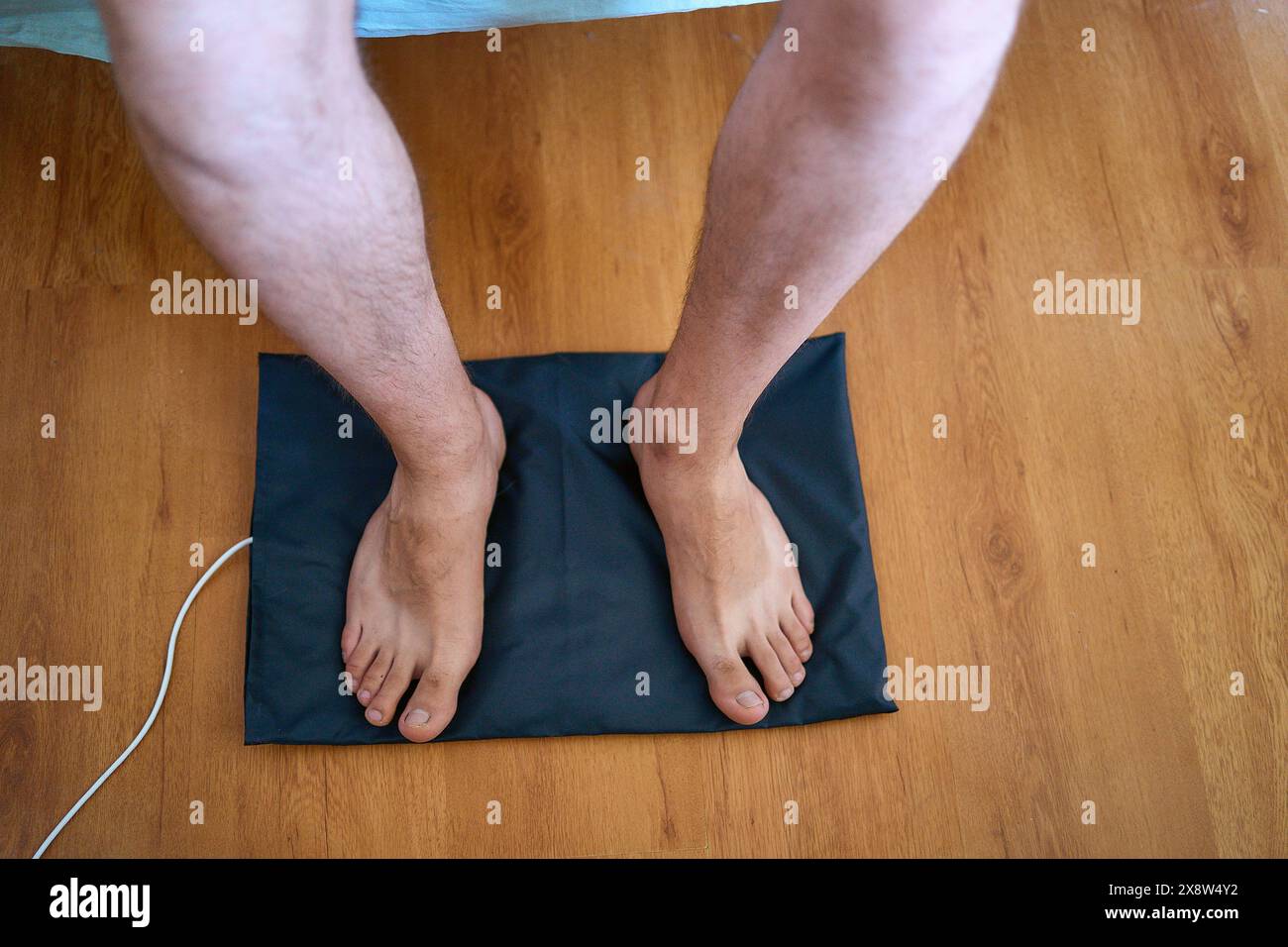 the man put his feet on the grounding wedge, self-soothing, relaxation ...