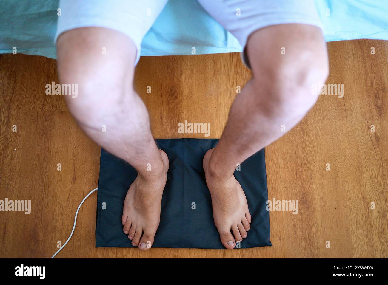 the man put his feet on the grounding wedge, self-soothing, relaxation ...