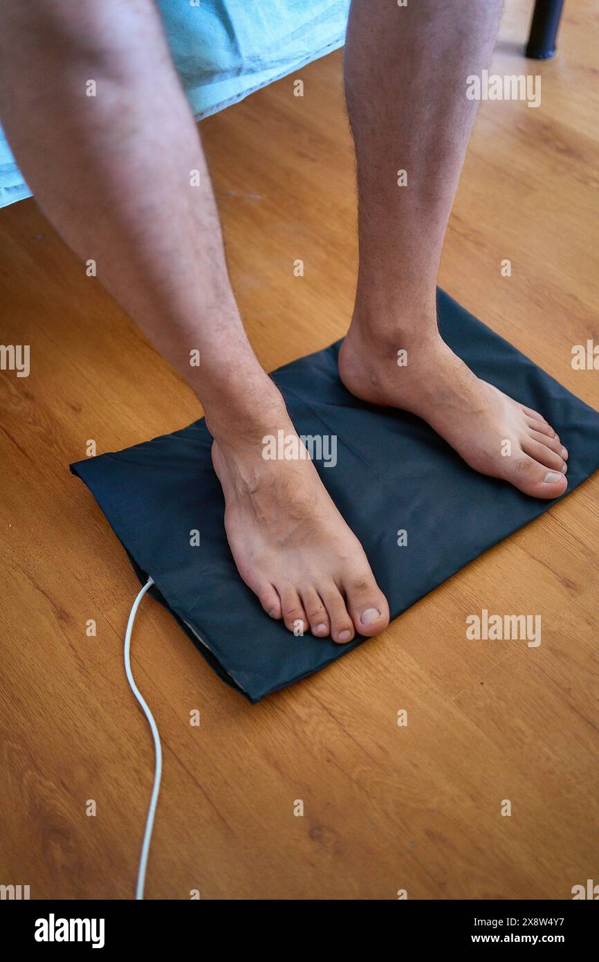 the man put his feet on the grounding wedge, self-soothing, relaxation ...