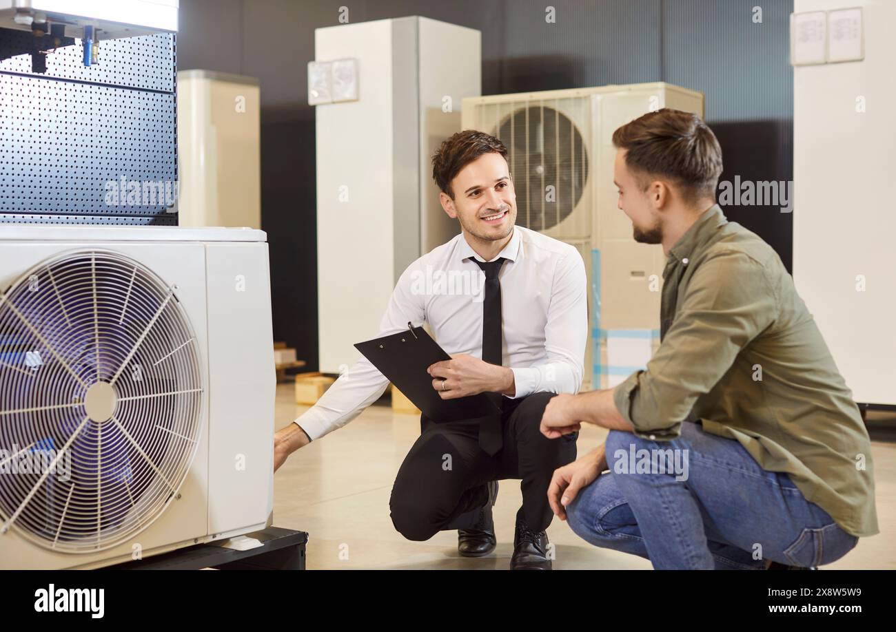 Air Conditioner Salesman Consulting Consumer Before Purchase In Store ...