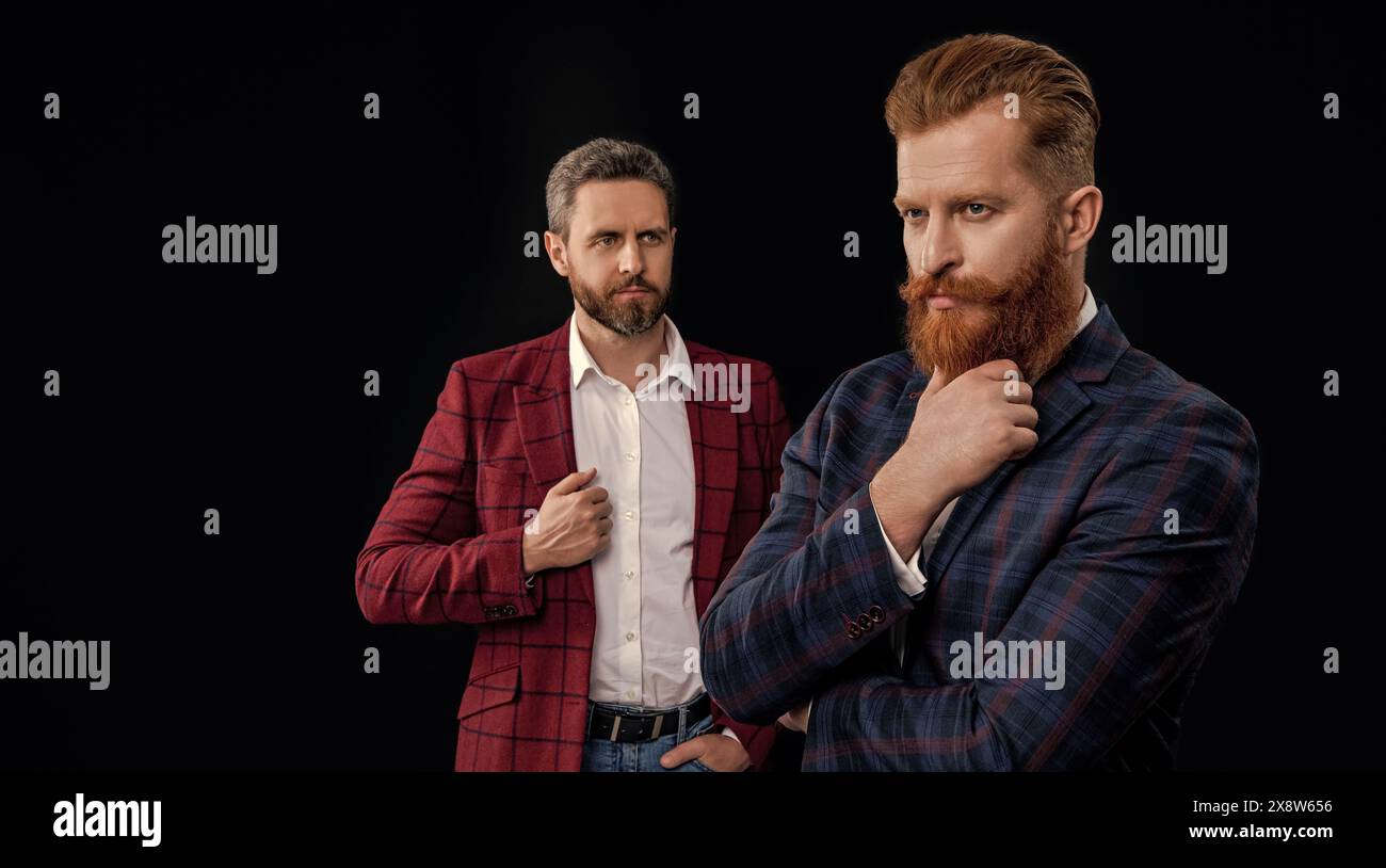 elegant men wearing menswear, copy space. studio shot of two men in ...