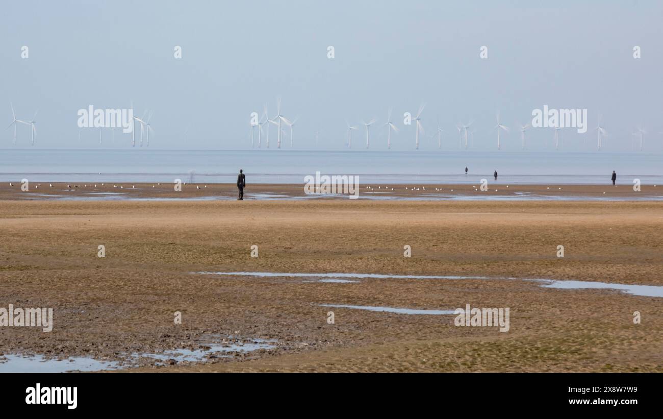 Crosby Beach with Antony Gormley Cast Iron Statues 2 Stock Photo - Alamy