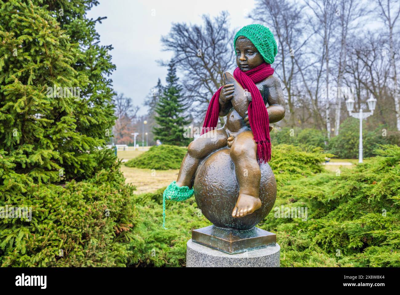 Statue of boy sitting with a fish, symbol of Frantiskovy lazne spa ...