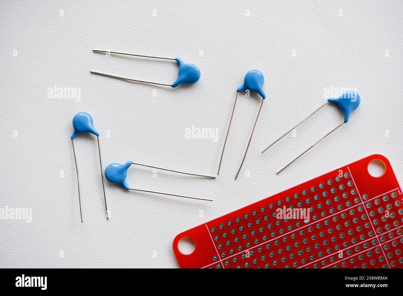 Red printed circuit board and chips and radio components. Capacitors ...