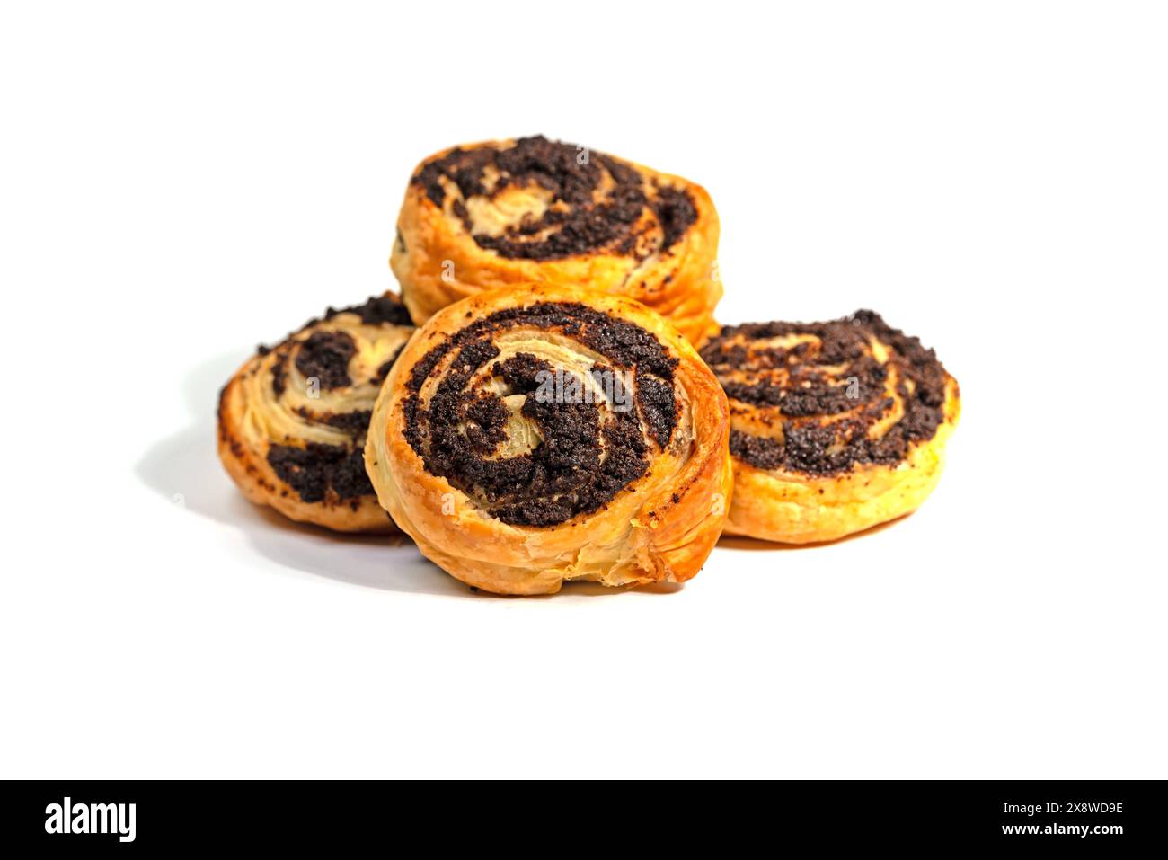 Baked Poppy seed snails against white background Stock Photo - Alamy