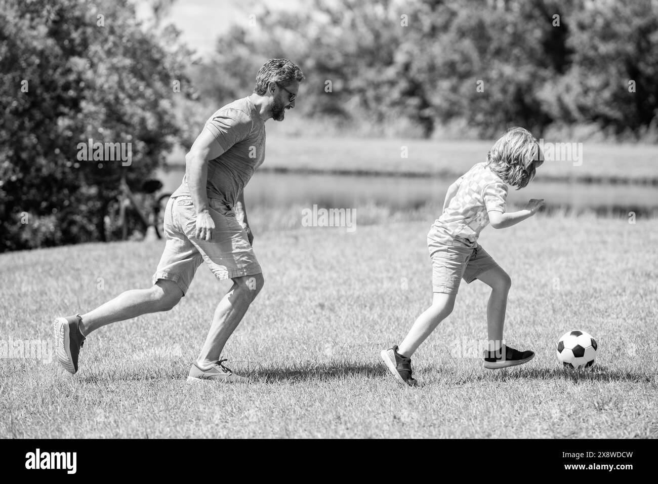 adventures between father and son. Active father son playing football ...