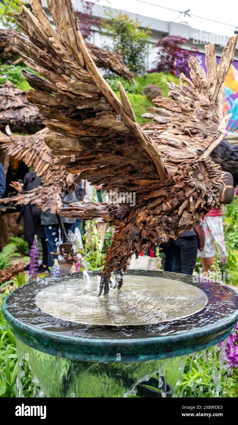 Wooden statue of an owl in flight at the 2024 RHS Chelsea flower show ...