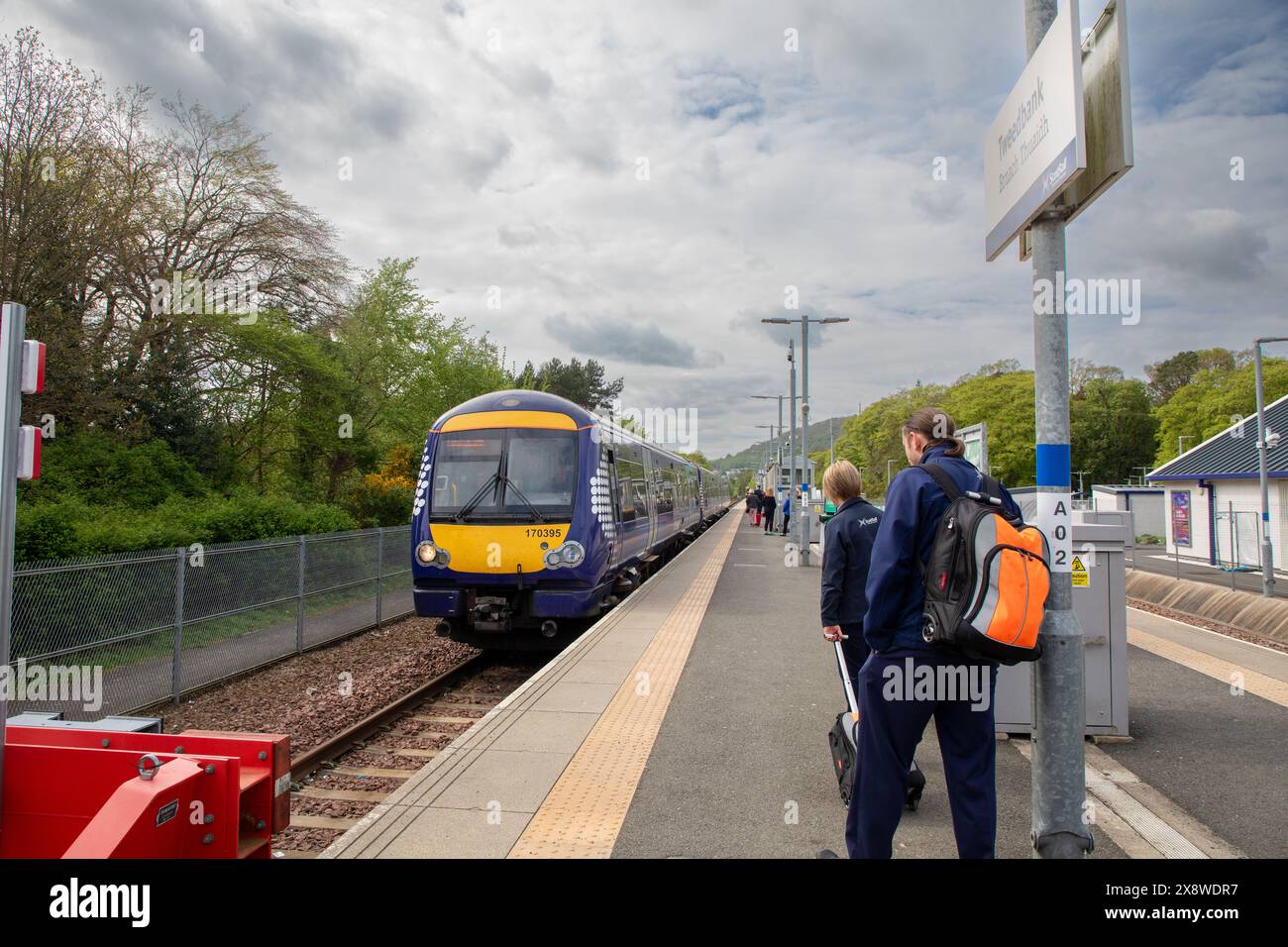 The crew of a ScotRail passenger train from Edinburgh waits to board at ...
