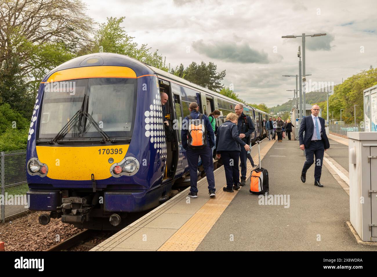 The crew of a ScotRail passenger train from Edinburgh waits to board ...