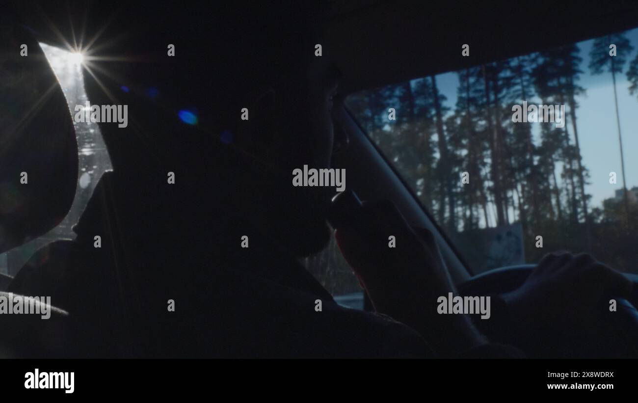 Man drives car and smokes. Media. Man is driving in car and smoking ...