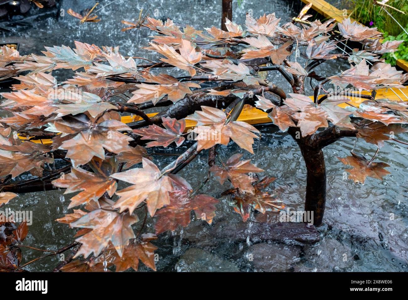 Close up of an ornate water feature in an outdoor water garden at the ...