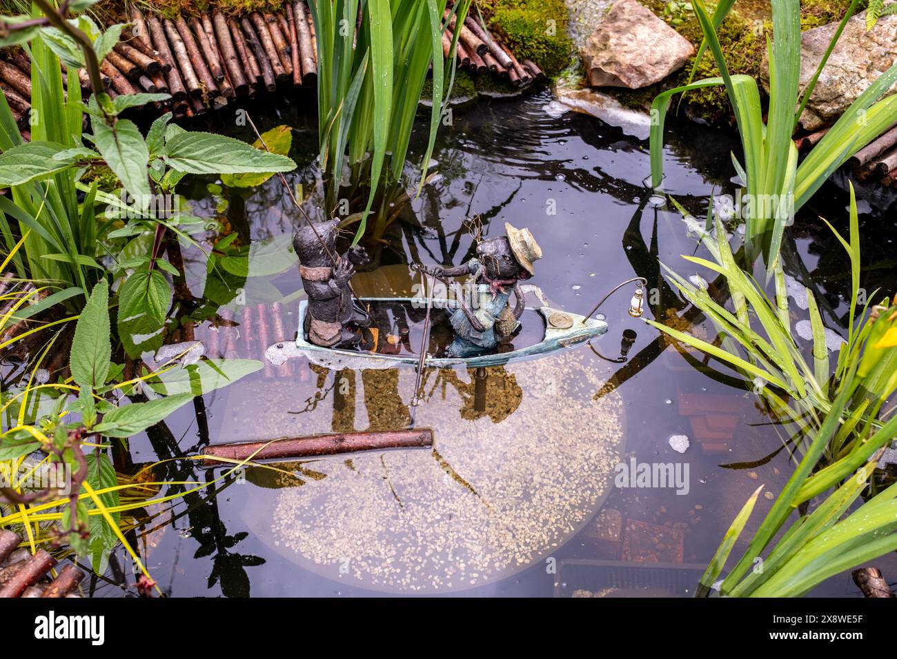 Wind in the Willows inspire Mole and Ratty in a boat statue in a pond ...