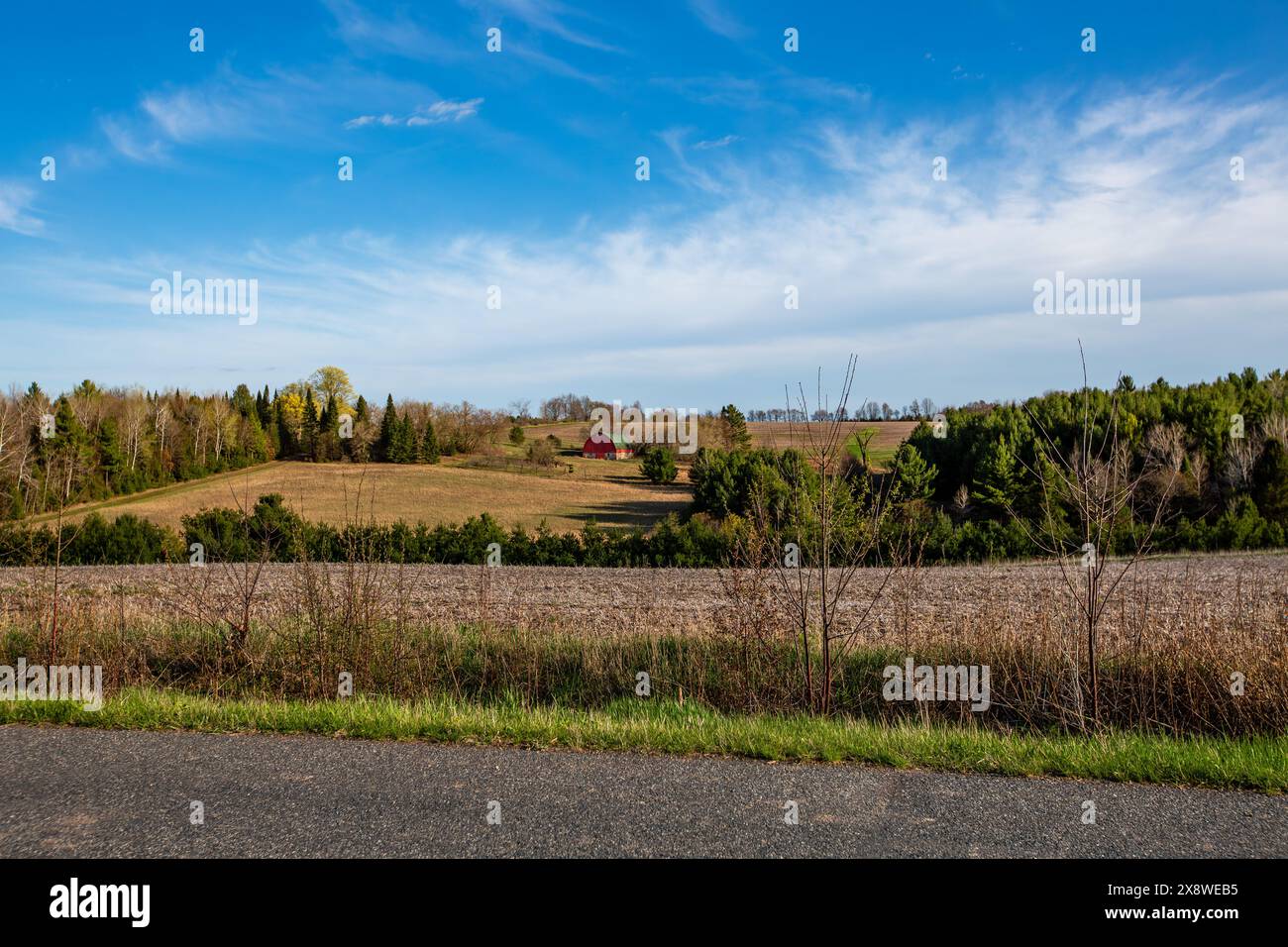 Wisconsin farmland with red barn in April, horizontal Stock Photo - Alamy