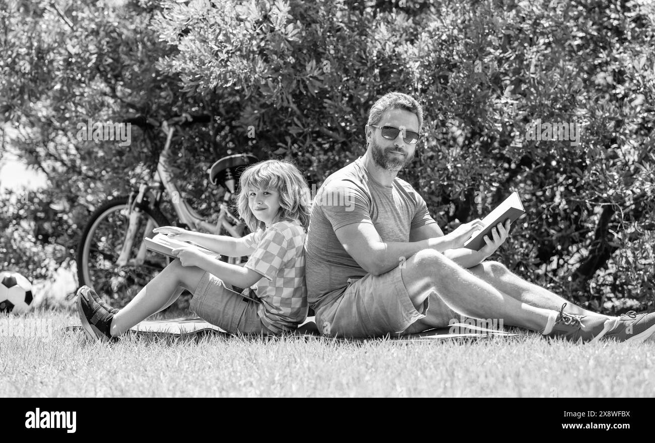 special moment for father and son. Father and son reading time. Father ...