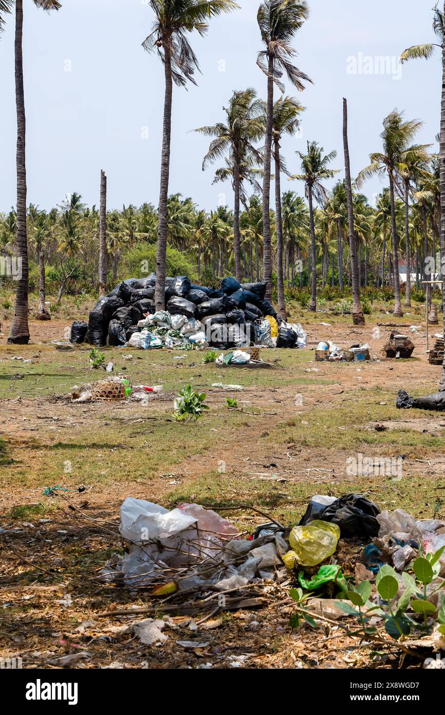 uge amounts of plastic and other garbage stacked and blowing on the ...
