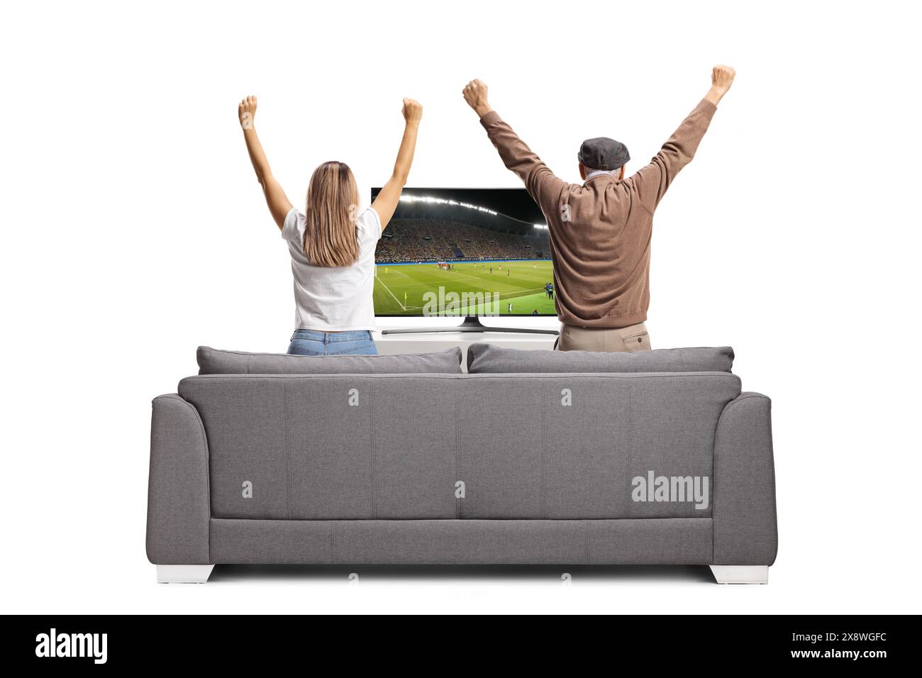 Excited young female and an elderly man watching a football match on tv ...