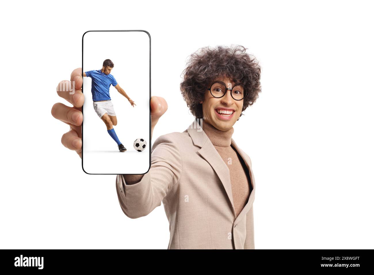 Happy young man showing a smartphone with football player on the screen ...
