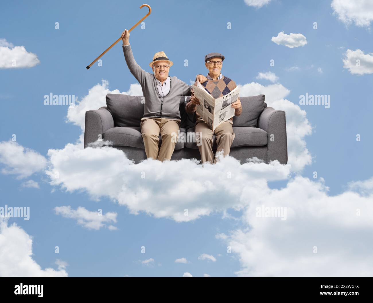 Happy elderly men sitting on a sofa and floating on a cloud up in the ...