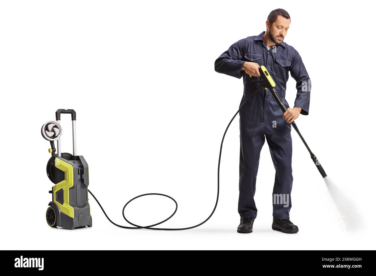 Worker cleaning with a high pressure washer machine isolated on white ...
