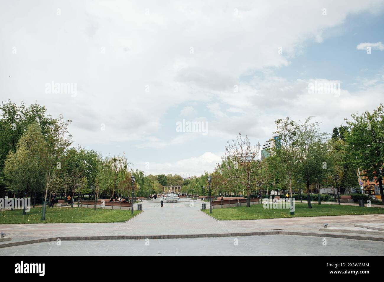 Brick path to park with greenery, trees, and grass Stock Photo - Alamy
