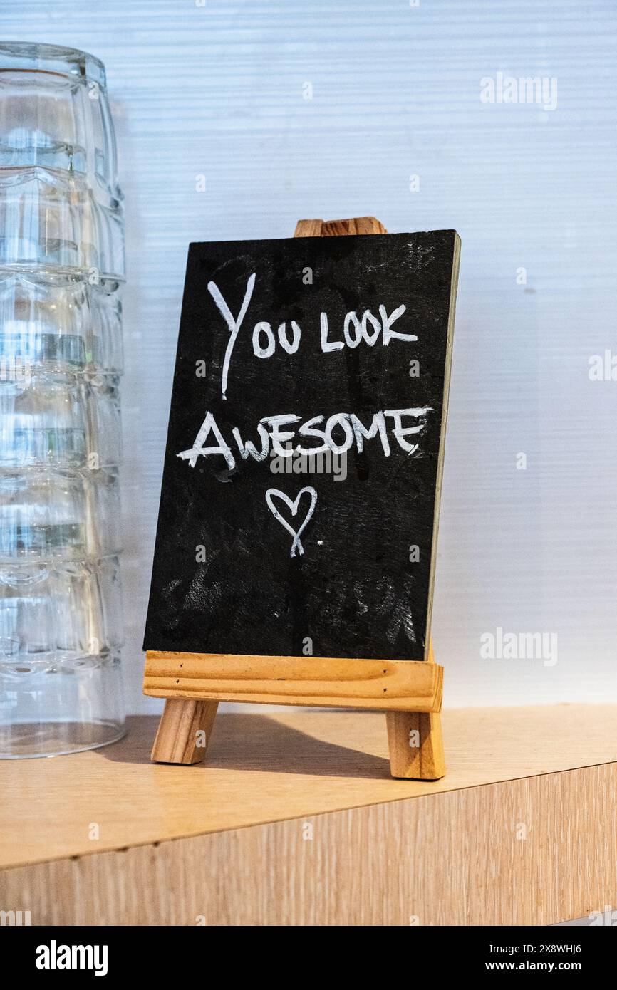 Inspiring you look awesome sign Stock Photo - Alamy