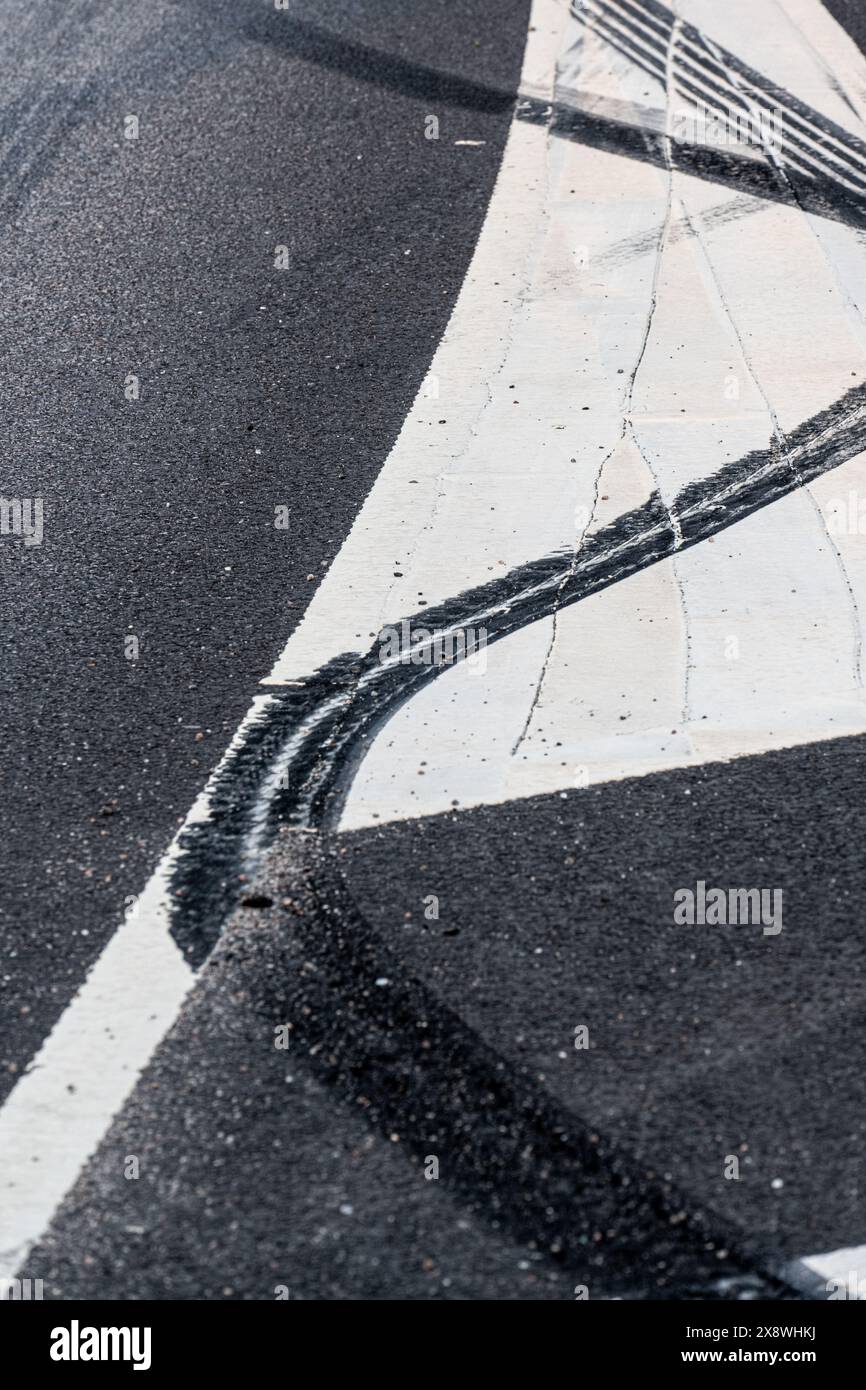 Black rubber tire marks in a street Stock Photo - Alamy