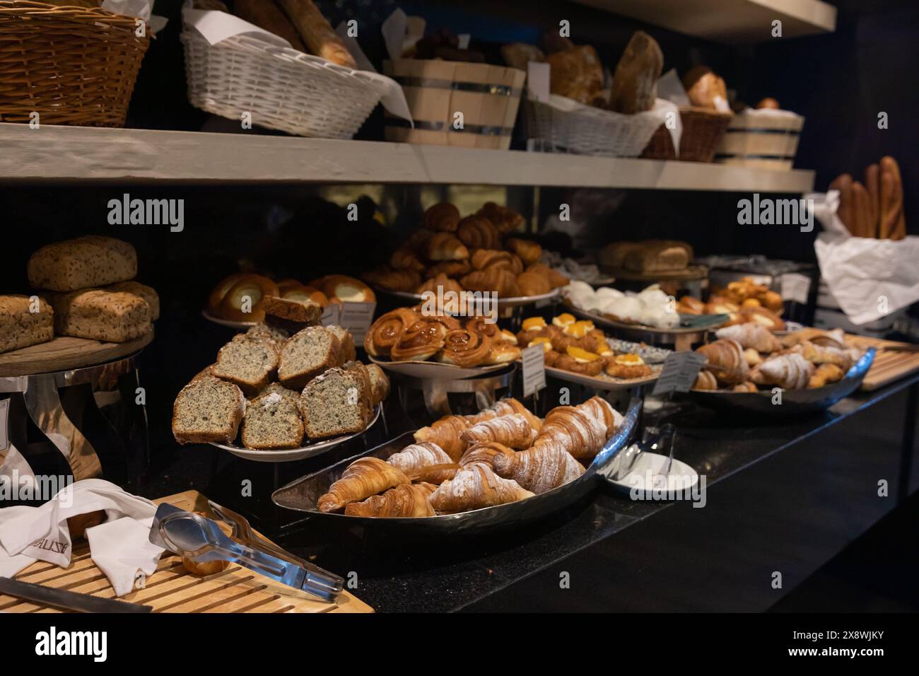 lots of baking bread and rolls for food in the store Stock Photo - Alamy