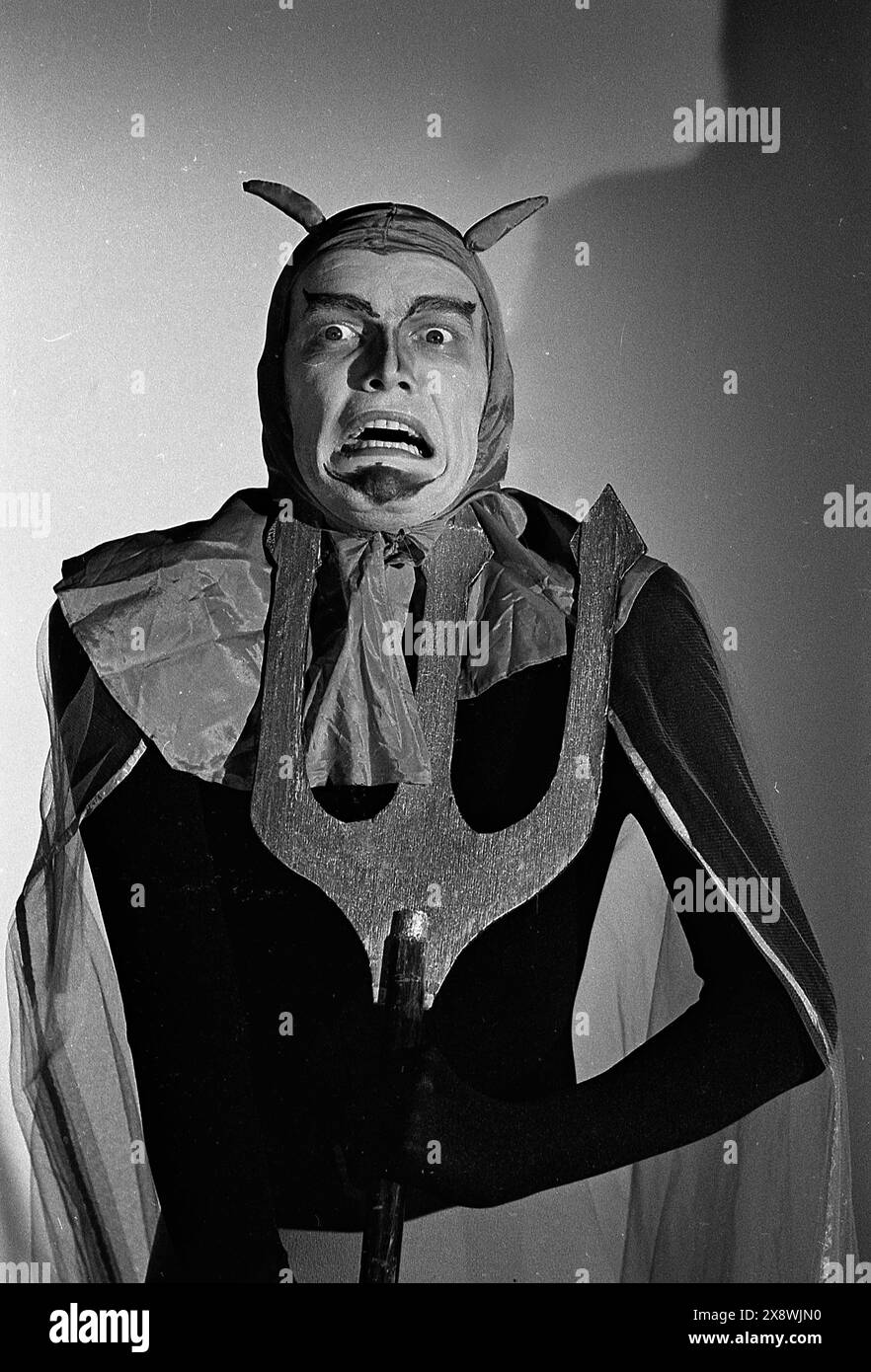 Argentine mime dressed as a devil in theatrical poses, Buenos Aires ...