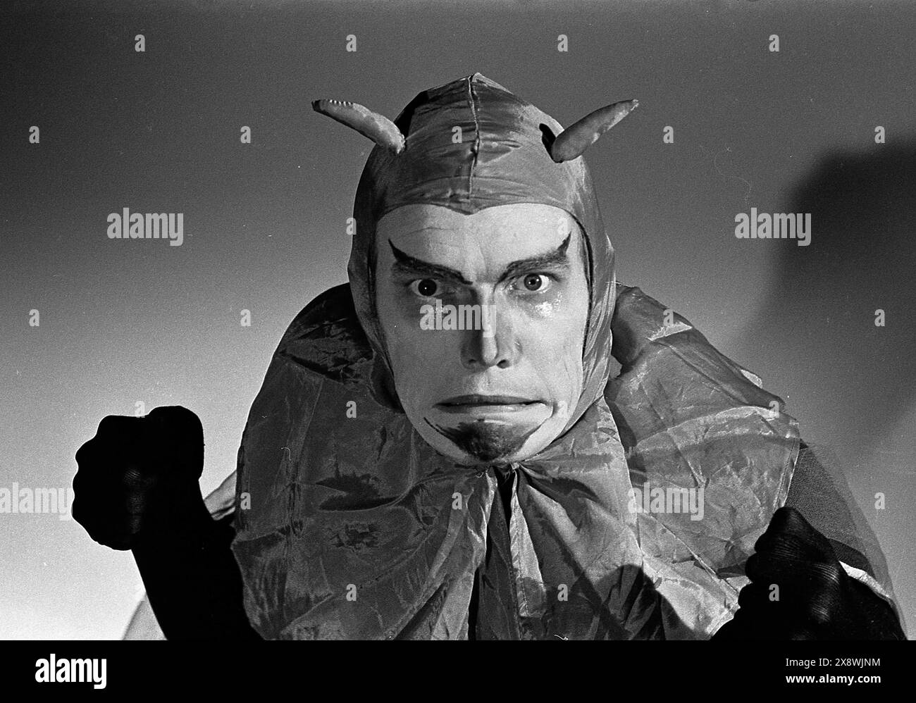 Argentine mime dressed as a devil in theatrical poses, Buenos Aires ...