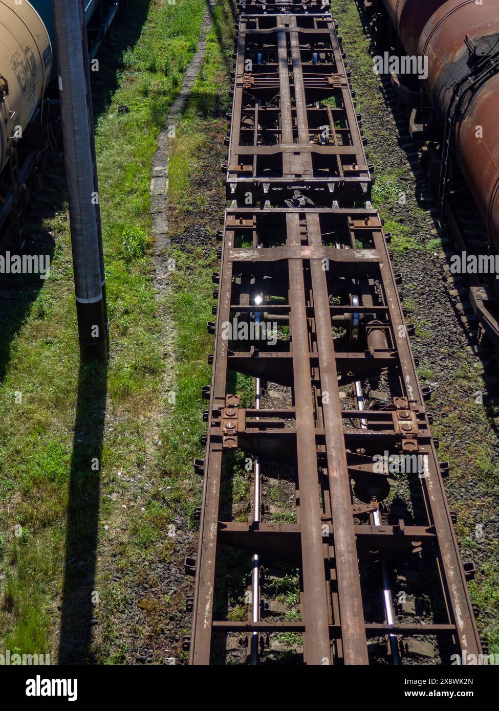 bases of railway cars on the tracks. Empty composition. A train without ...
