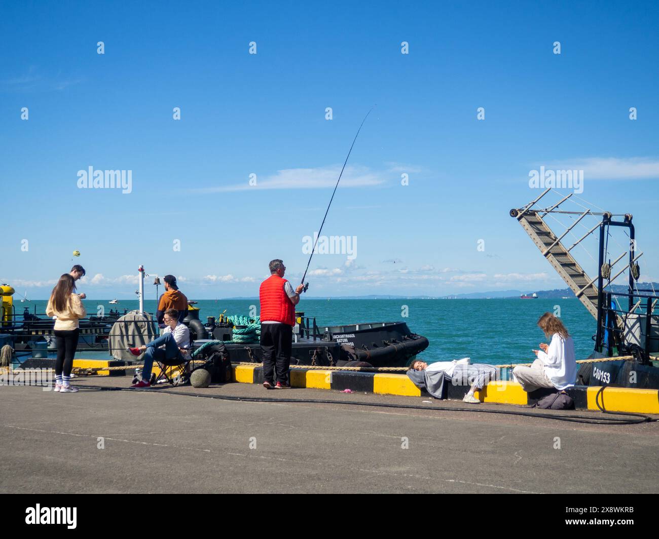 Batumi, Georgia. 05.18.2024 Vacationing people at the sea dock. Port of ...