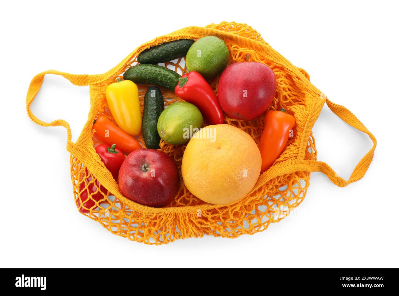 String bag with vegetables and fruits isolated on white, top view Stock ...