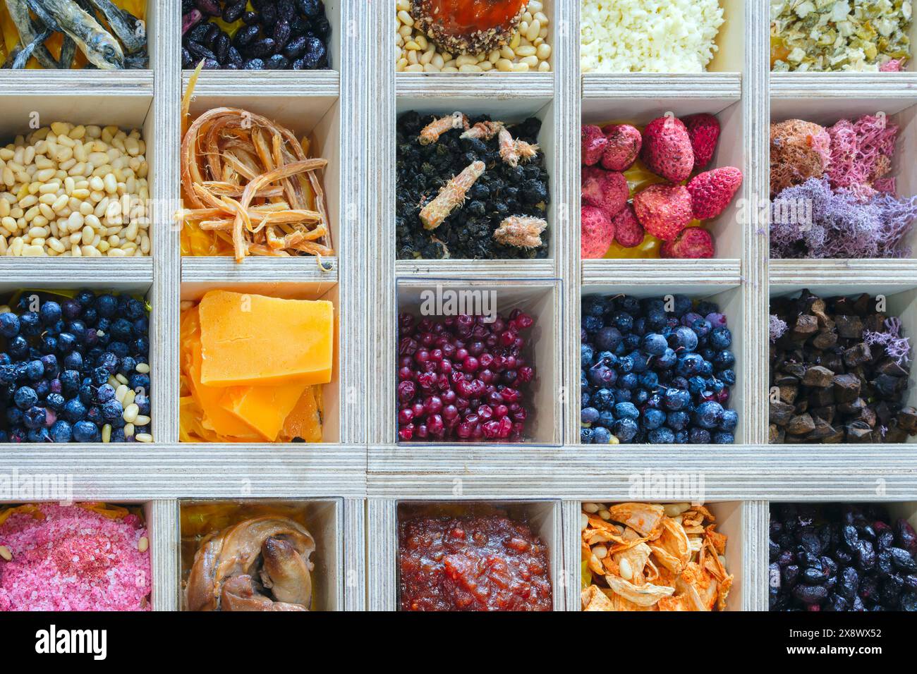 A wooden box filled with a variety of fruits and vegetables. The box is ...