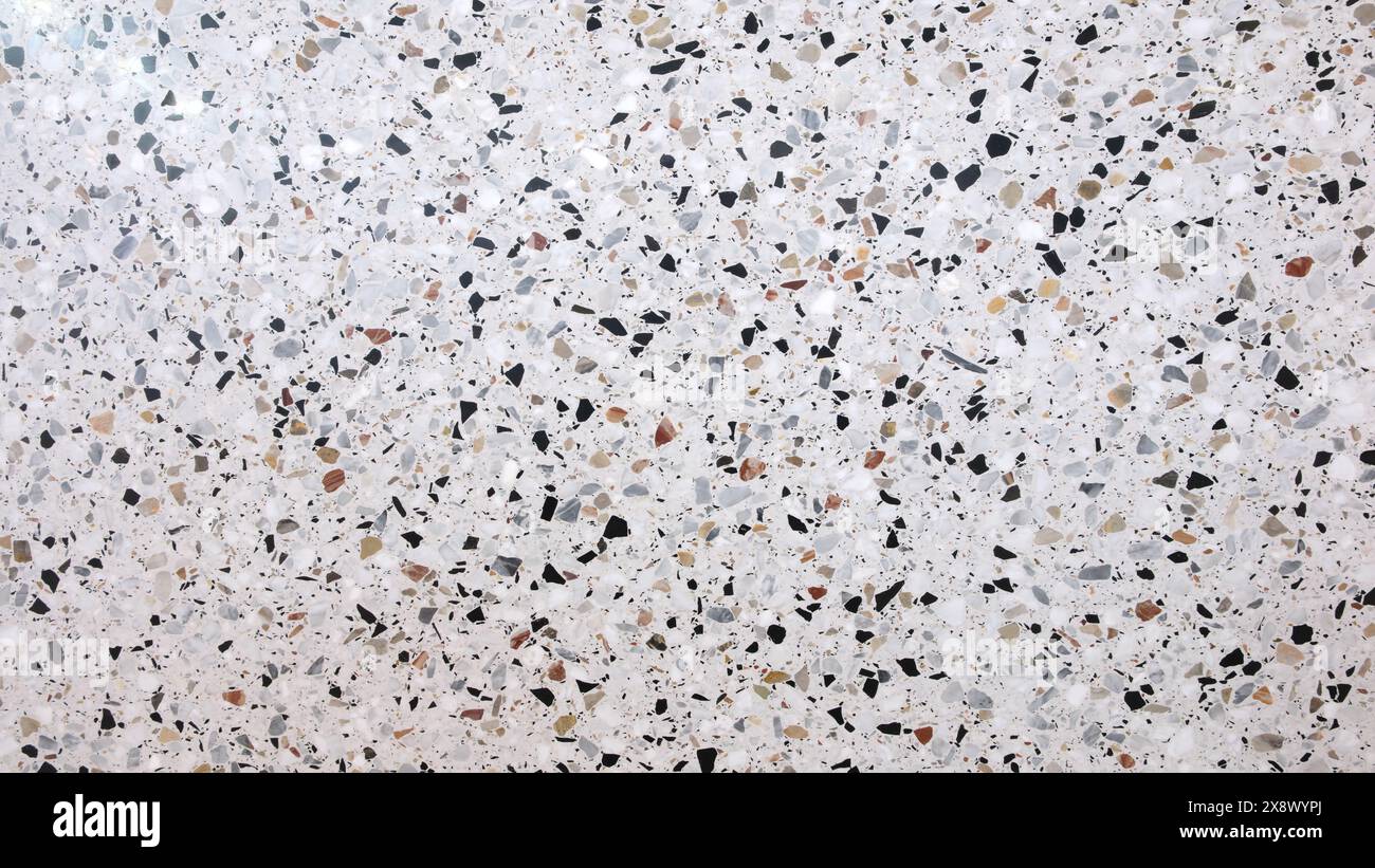 Abstract textured stone background with a pattern of small particles ...