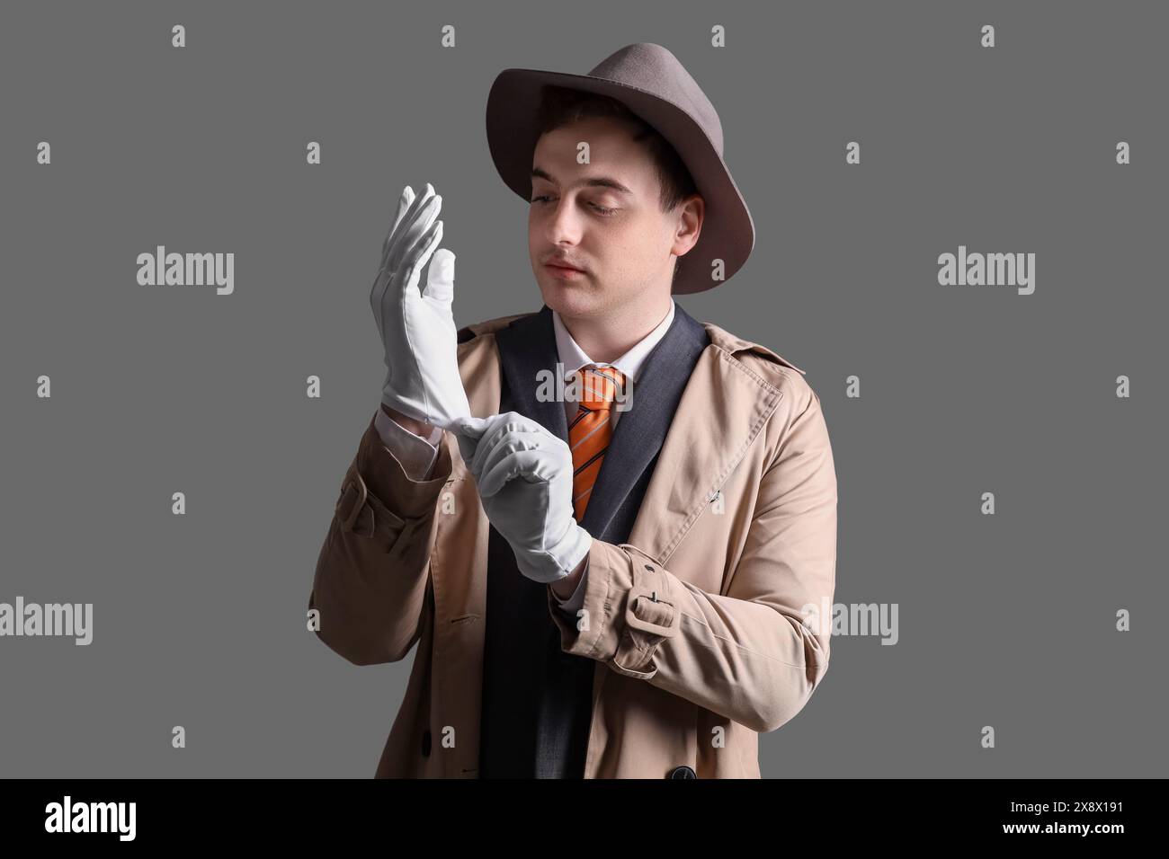 Male spy in gloves on dark background Stock Photo - Alamy