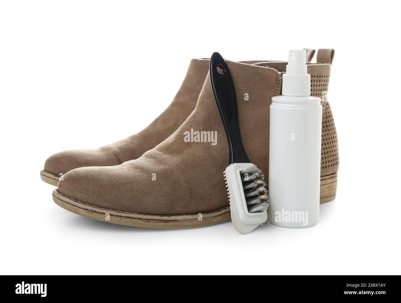 Brush, boots, cleaning spray and shoe polish isolated on white ...