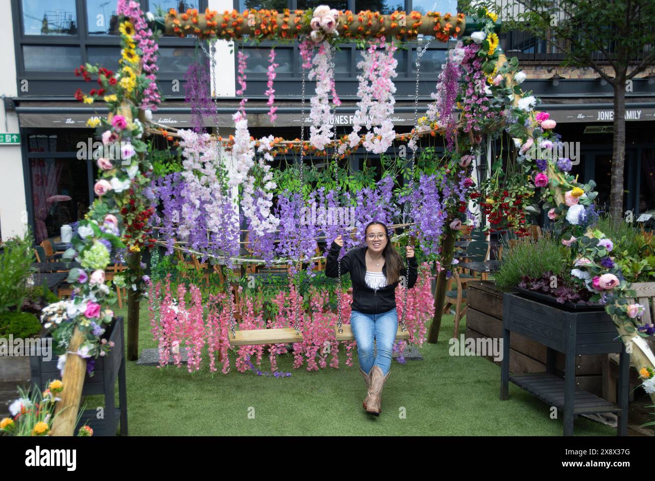 London, UK. 27 May 2024. Visitors view a floral display in Eccleston Yards on the last day of ...