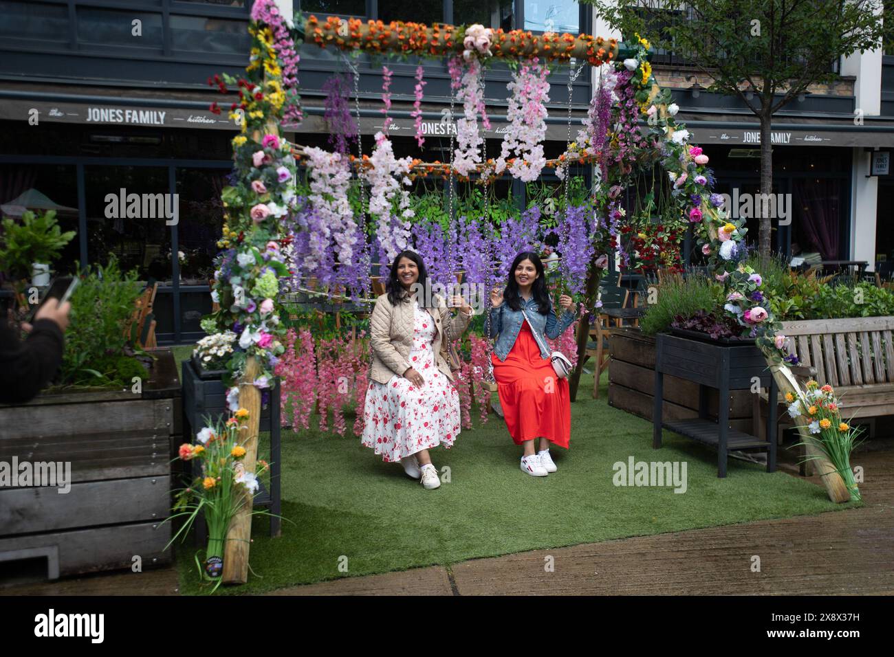 London, UK. 27 May 2024. Visitors view a floral display in Eccleston Yards on the last day of ...