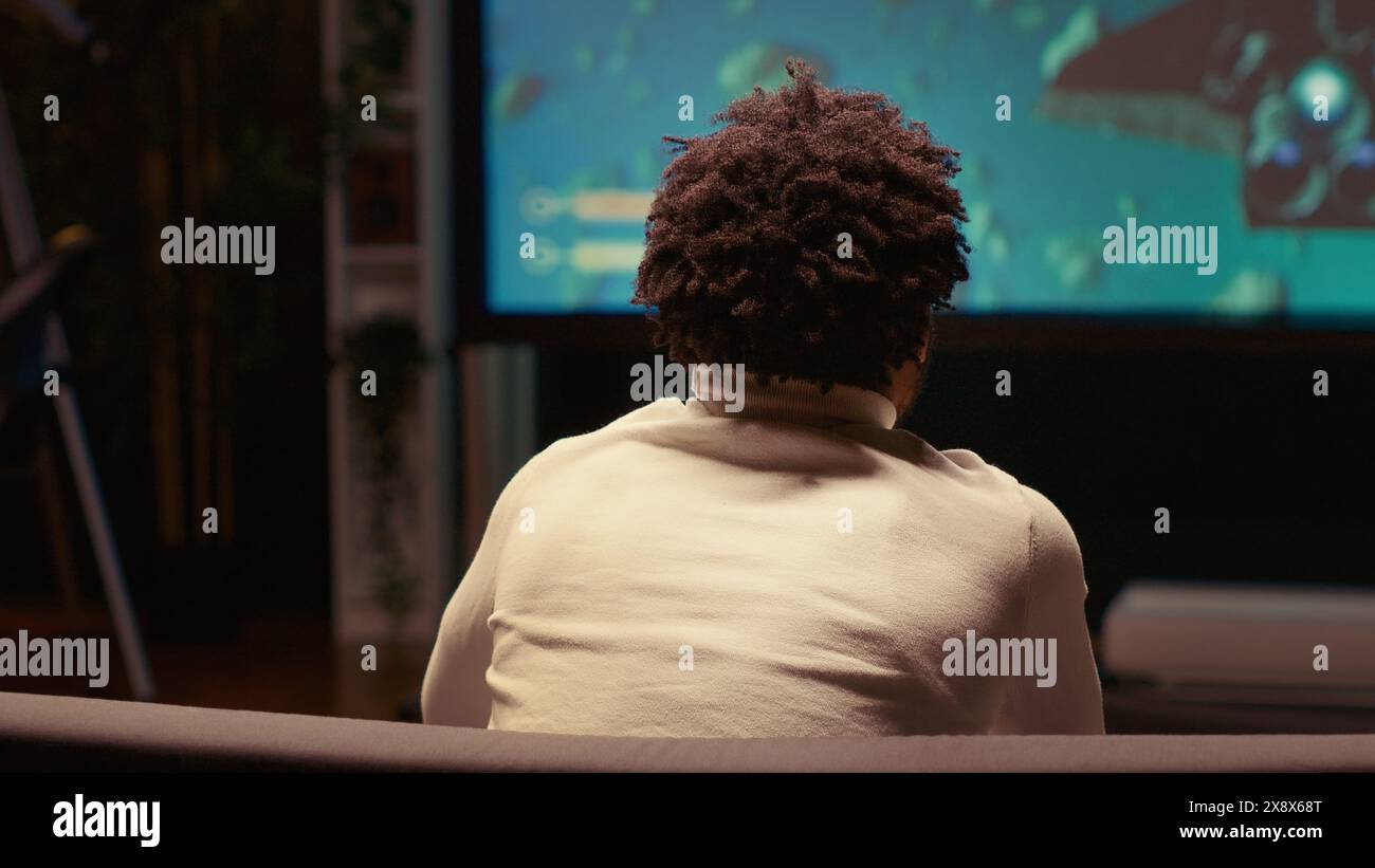 Man plays singleplayer game with spaceship shooting laser streams at ...