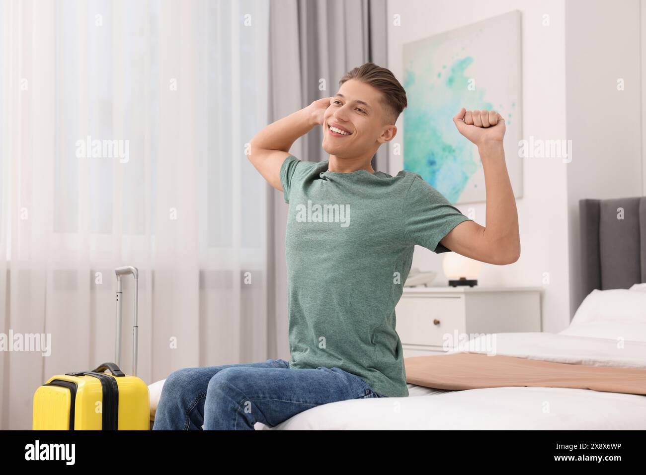 Happy man stretching on luxury hi-res stock photography and images - Alamy