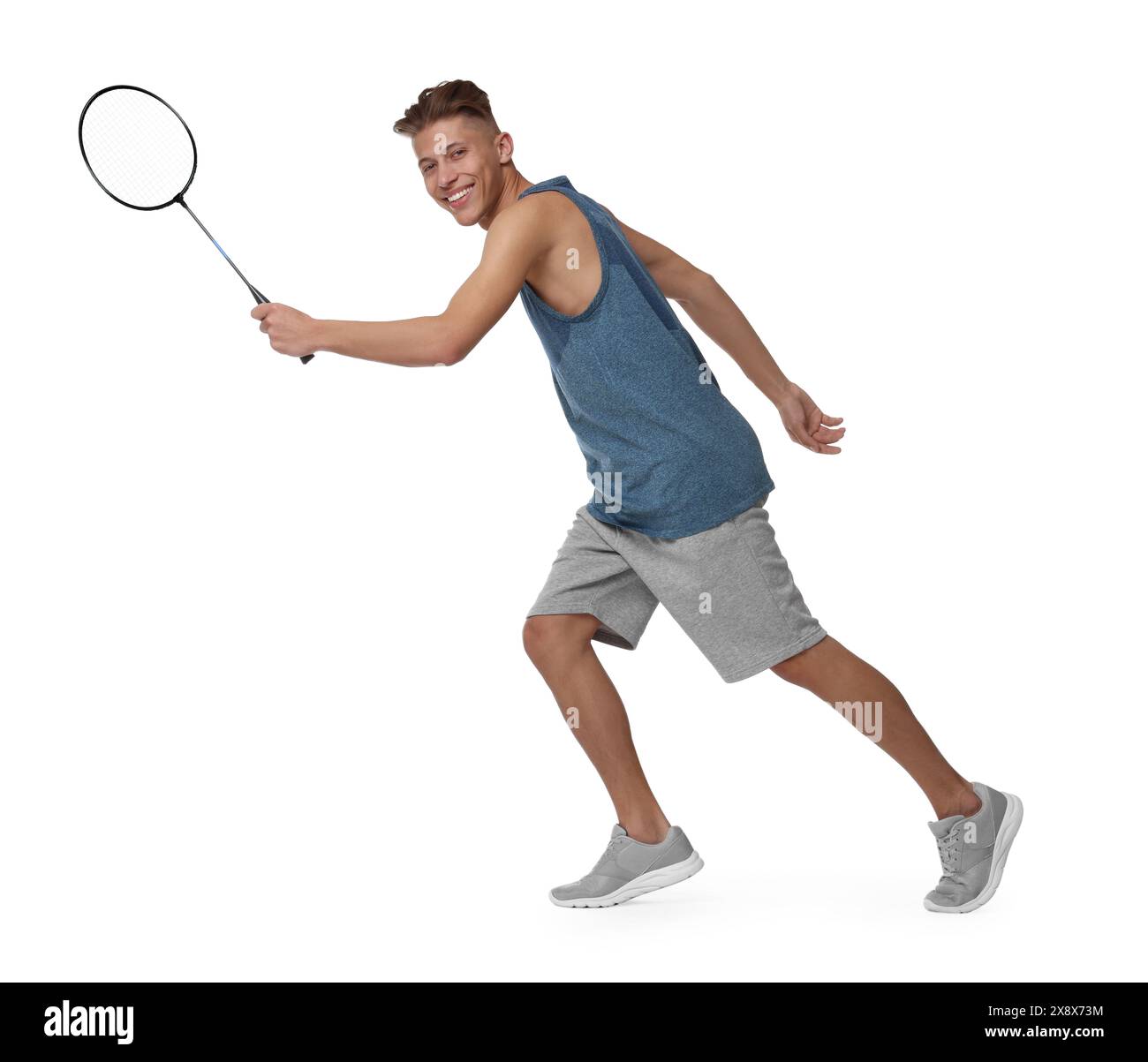 Young man playing badminton with racket on white background Stock Photo ...