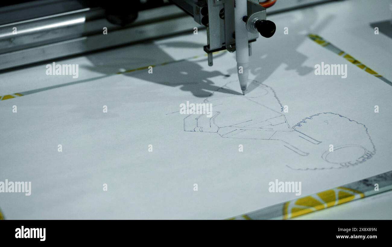 Automated machine draws image on paper. Media. Robotic machine that ...