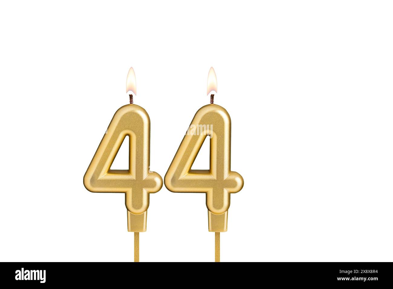 Golden number 44 birthday candle on white background Stock Photo - Alamy