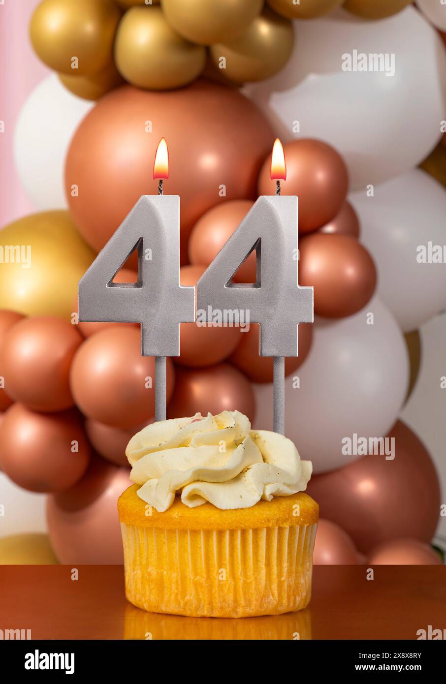Birthday candle number 44 - Celebration balloons background Stock Photo ...