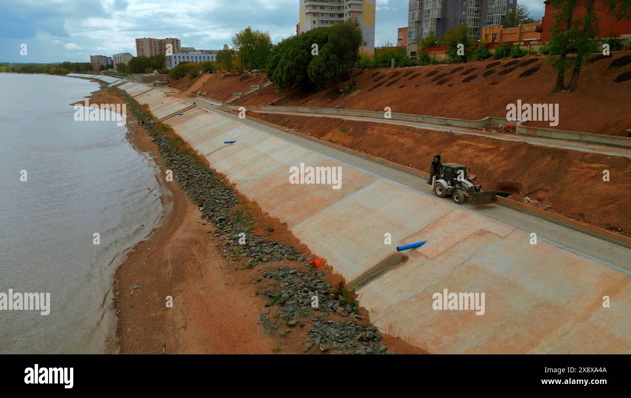Construction and strengthening of a new safety embankment along the ...