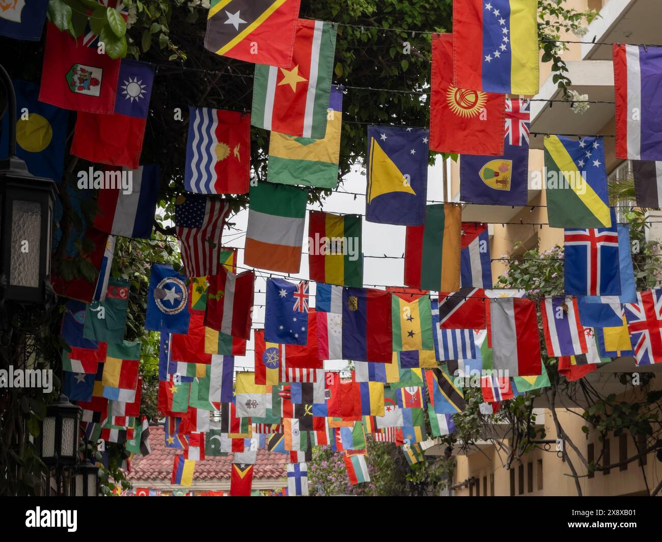 Flags from many countires fly above the streets of the Getsemani ...