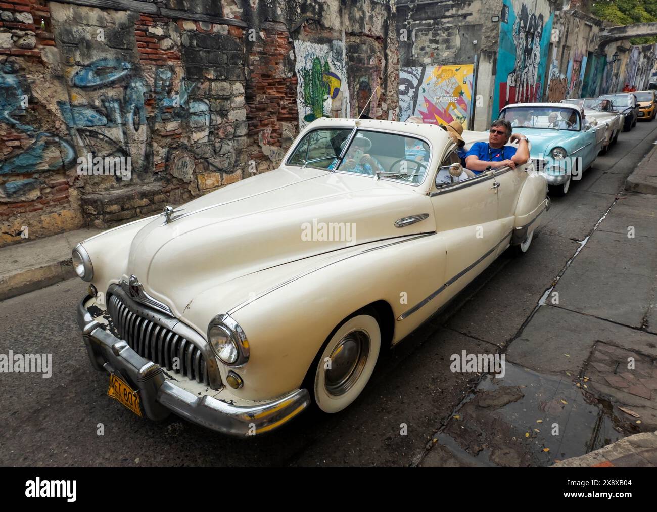 Historic American cars and Murals in the Getsemani neighborhood of ...