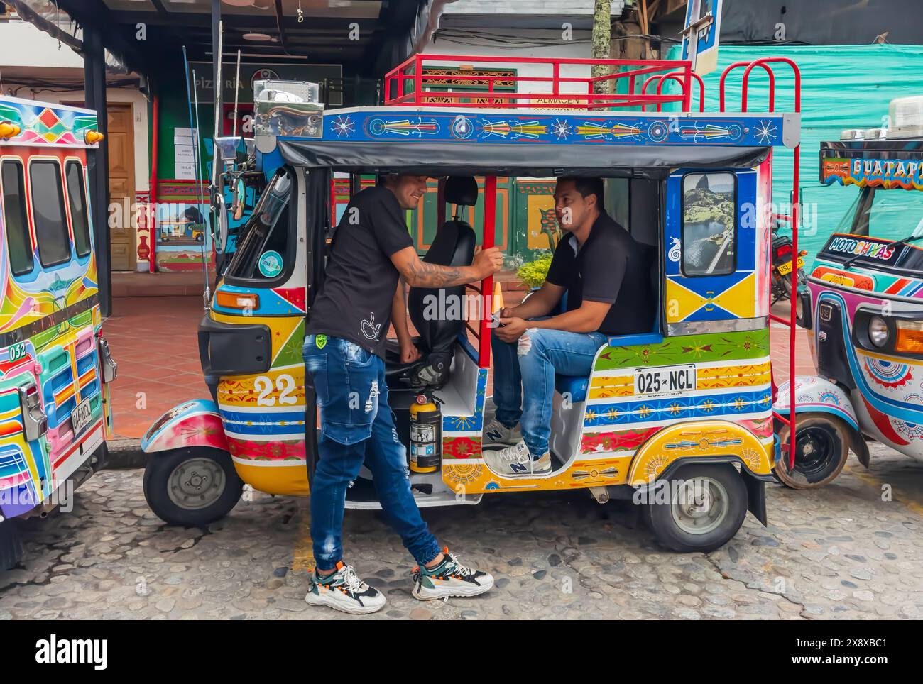 Three wheeled tempu's are used as taxis in the quaint town of Guatape ...